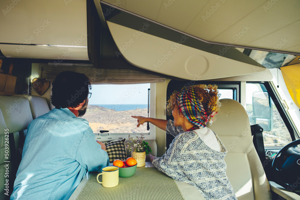 Back view of a couple admiring the nature outdoors view outside thw ...