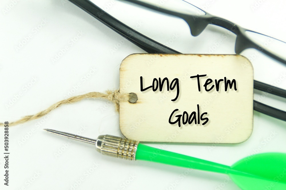 glasses, arrows and wooden tags with the words long term goals Stock ...