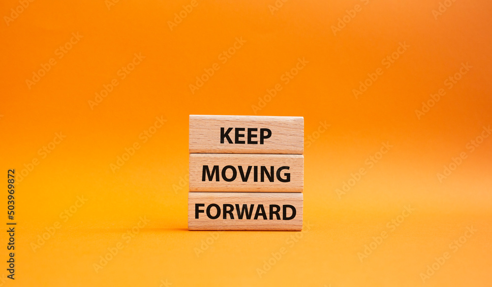 Keep moving forward symbol. Concept words keep moving forward on wooden ...