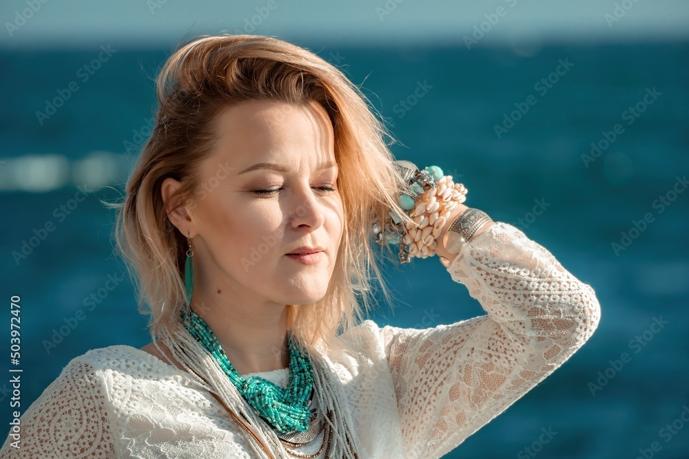 Woman in bohemian clothing on beach at sunset. Boho style for ...
