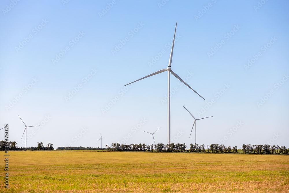 Panoramic landscape view of new white modern wind turbine farm power ...