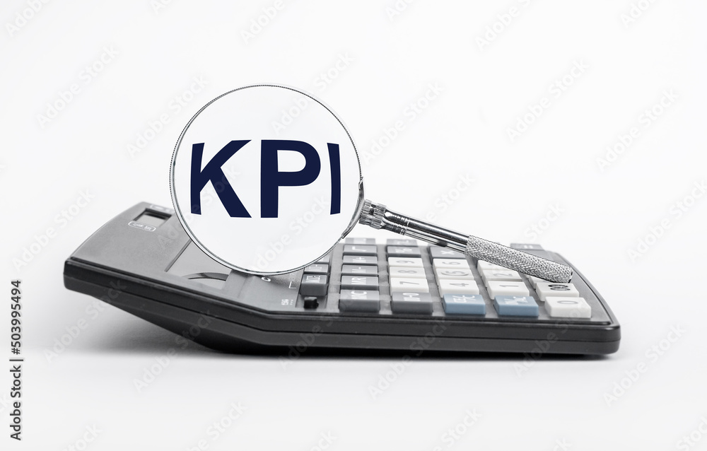 Key performance indicators. Magnifying glass with KPI letters at ...