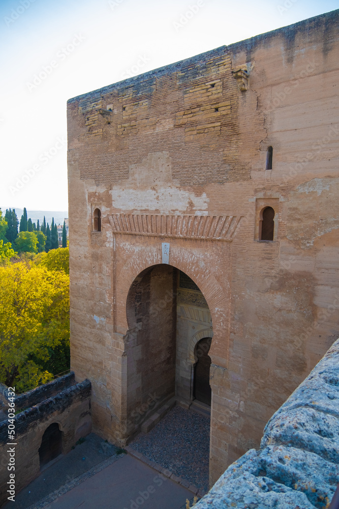 Tower view with arch and wooden door in Arabian style Stock Photo ...