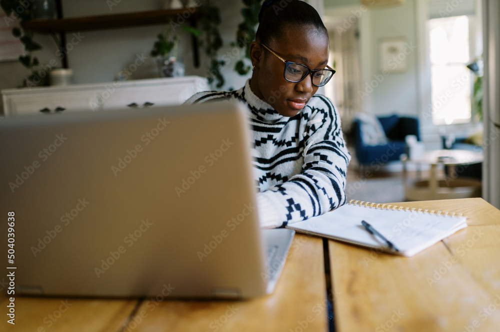 Teenage black girl studying for a test at home Stock Photo | Adobe Stock