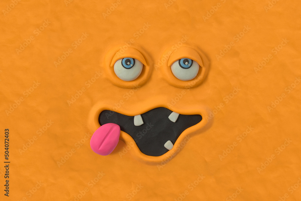 Funny monster with his tongue out, fabulous creature made by hand from ...