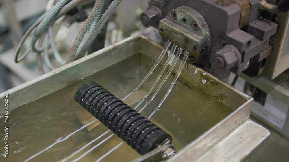 Plastic extrusion process in close up. Twin screw extruder. Plastic ...