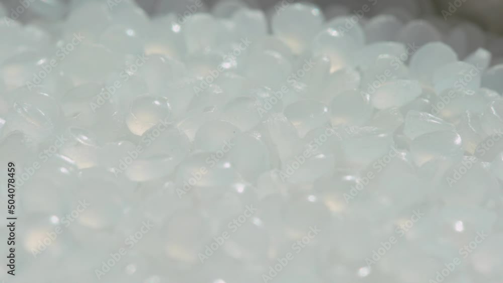 Plastic pellet close up and pan. Raw material for plastic compounding ...