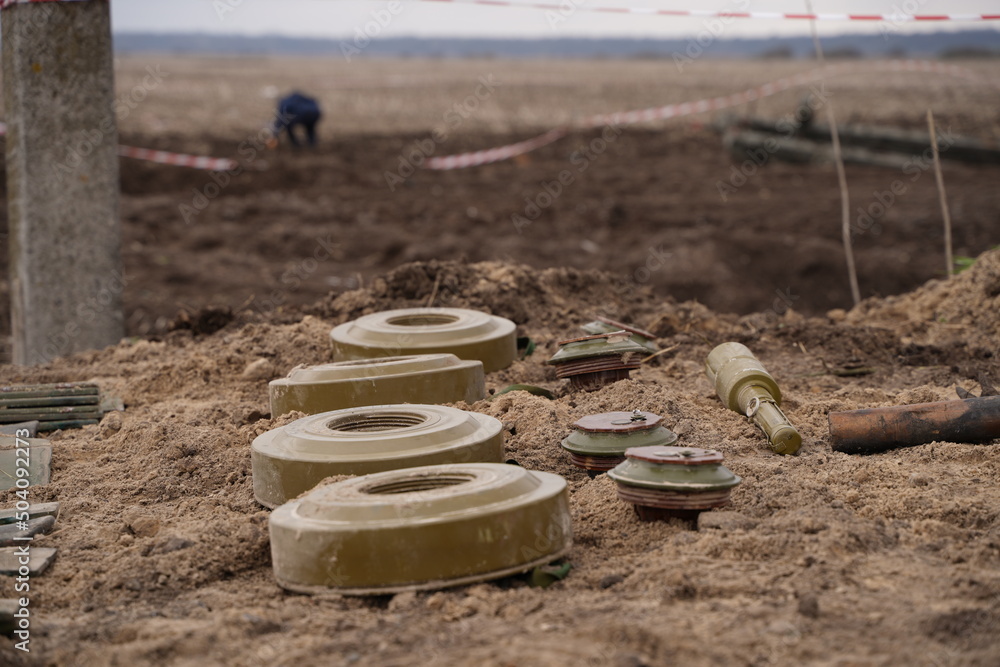 Demining by troops of the territory. Many mines, shells, artillery ...