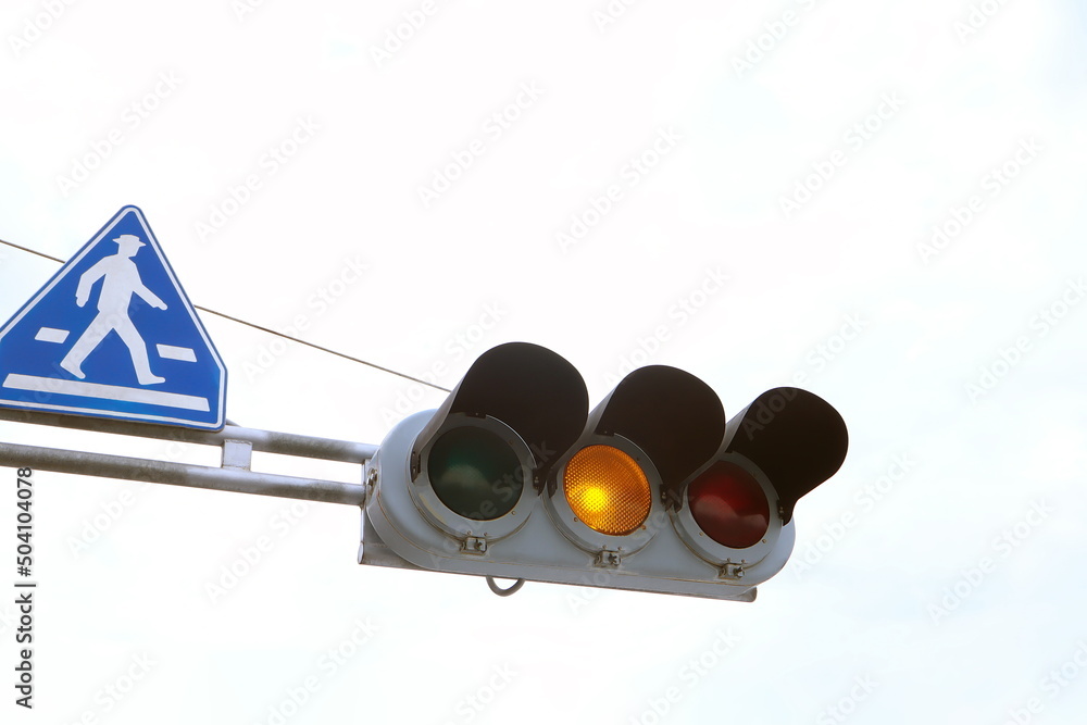 traffic lights , pedestrian crossing lights , showing yellow color for ...