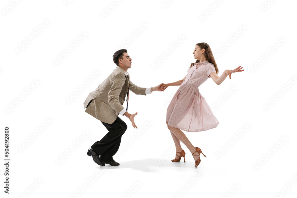Young man and woman in vintage retro style outfits dancing social dance ...