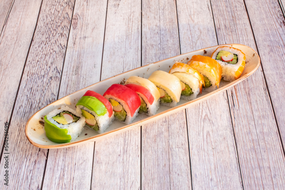 Rainbow roll style uramaki is a type of uramaki in which each bite has ...
