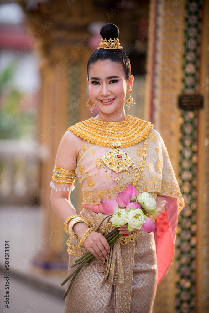 Beautiful Thai girl in traditional dress costume in Thailand temple ...