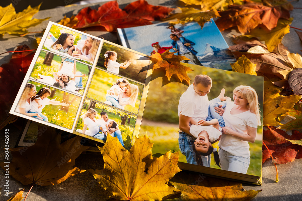 Photobook on the leaves background, closeup of photobook, family photo ...