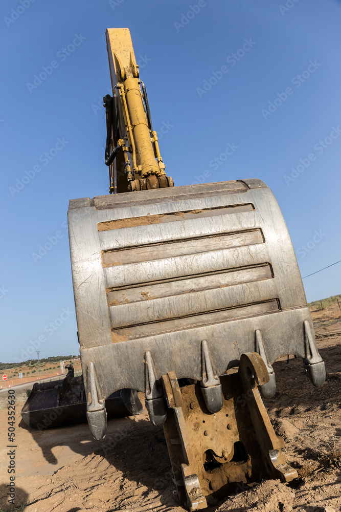 Excavator shovel and road construction equipment Stock Photo | Adobe Stock