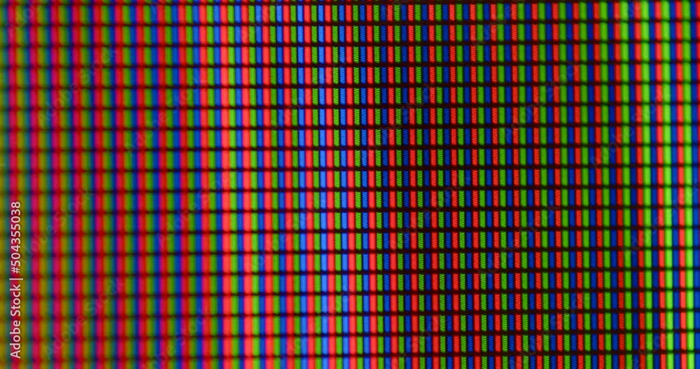 Macro of RGB pixels of a computer screen monitor. The movement of color ...