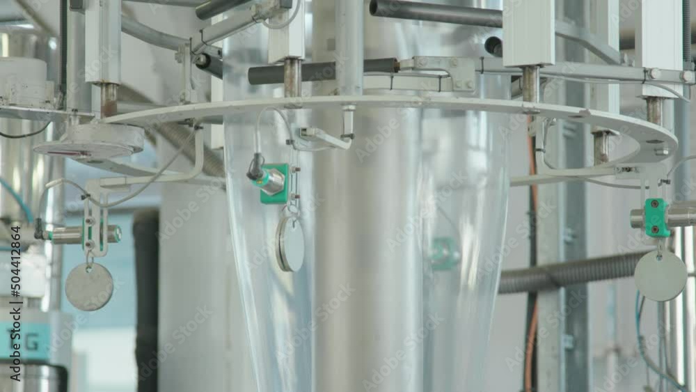 Large bubble of multilayer plastic blown film coming out of air ring ...