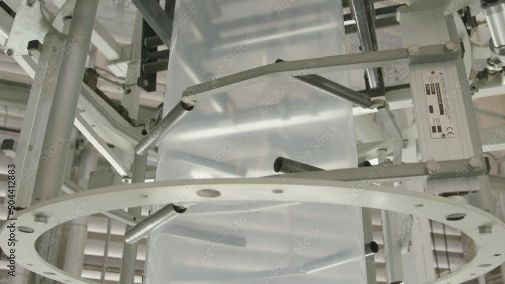 LDPE multilayer blown film extrusion system. Blown film bubble moves ...