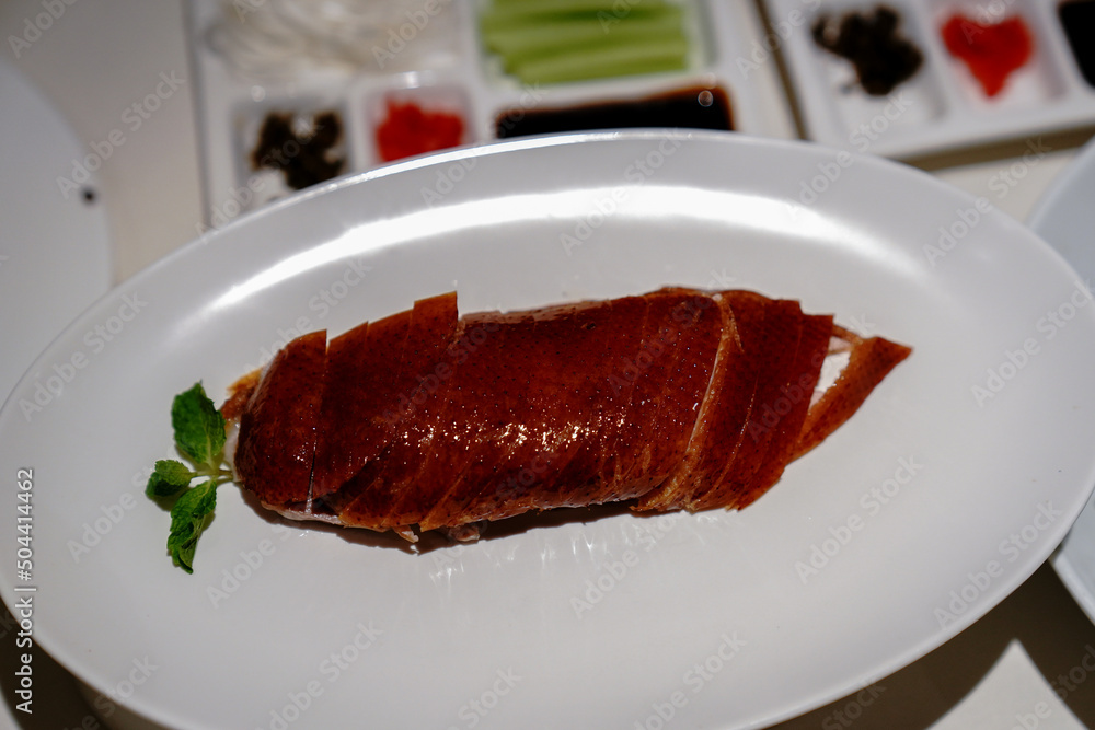 Chinese cook prepares Peking Roast Duck. Peking Duck is a famous duck ...