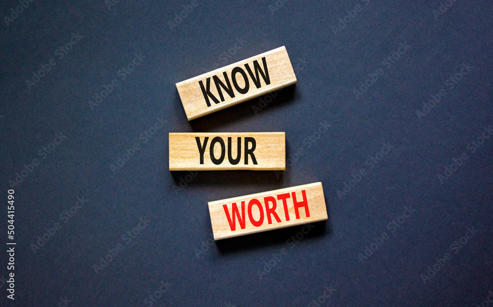 Know your worth symbol. Concept words Know your worth on wooden blocks. Beautiful black table ...