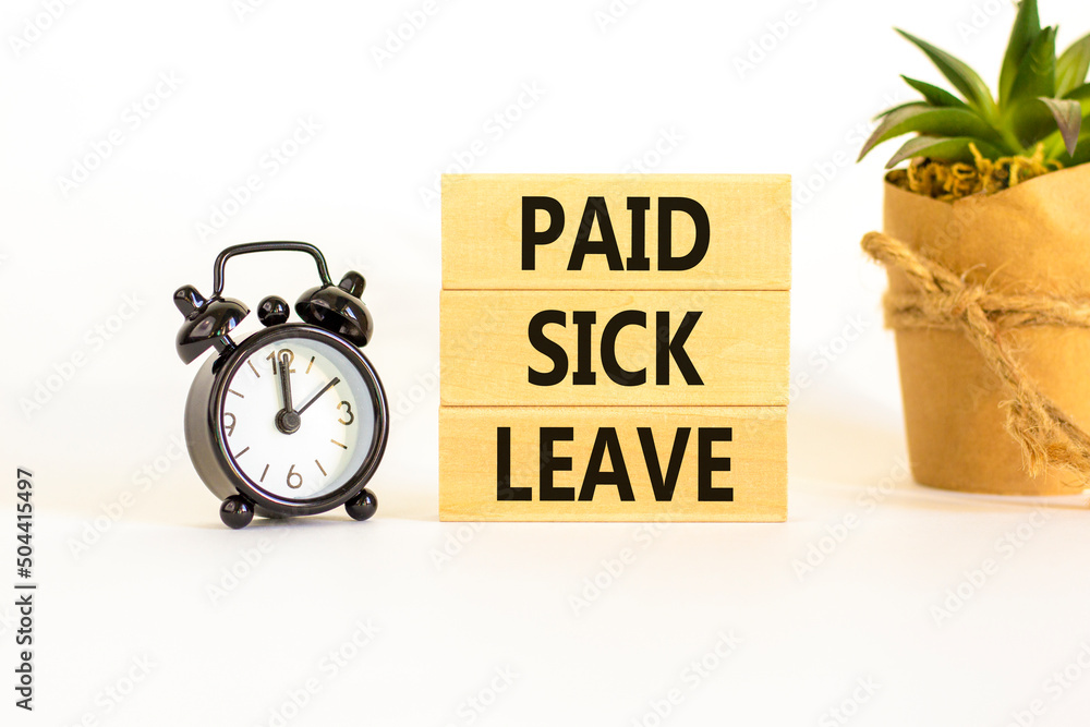 Paid sick leave symbol. Concept words Paid sick leave on wooden blocks ...