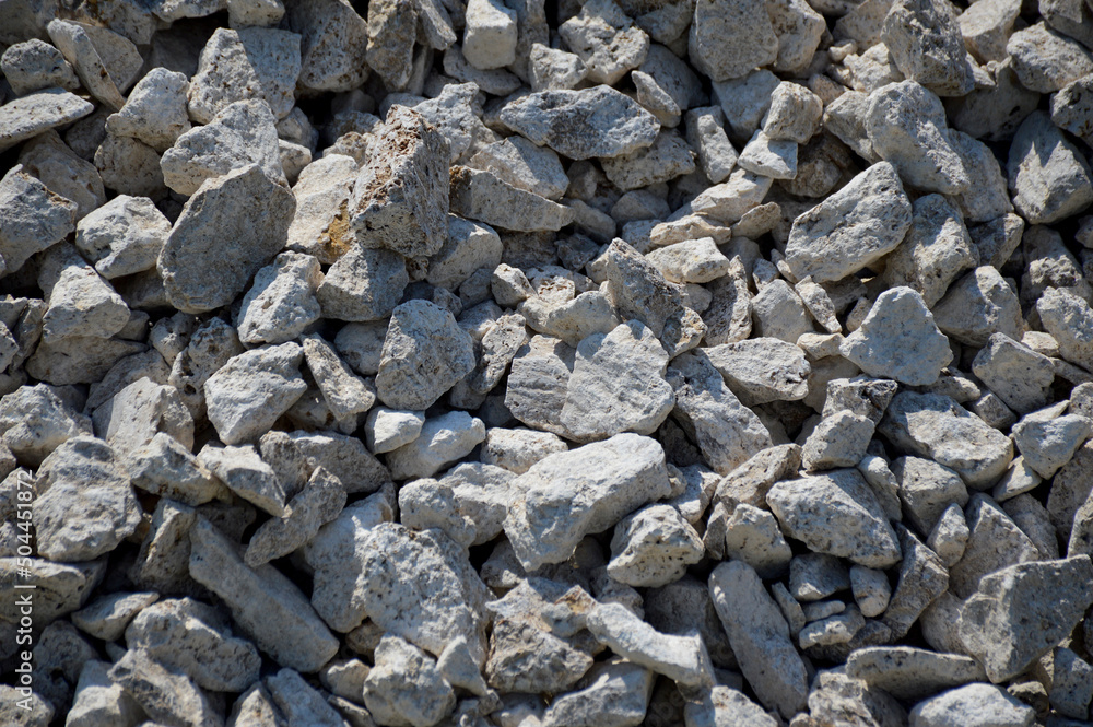 Crushed rock close up. Small rocks ground. Crushed stone road building ...