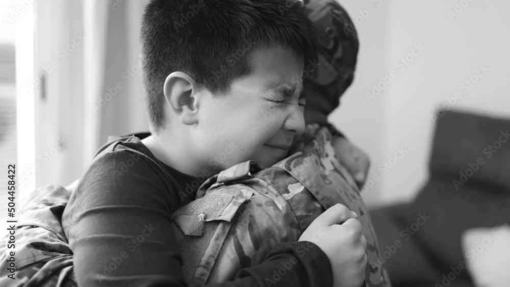 Military soldier father hugging his son after homecoming reunion ...