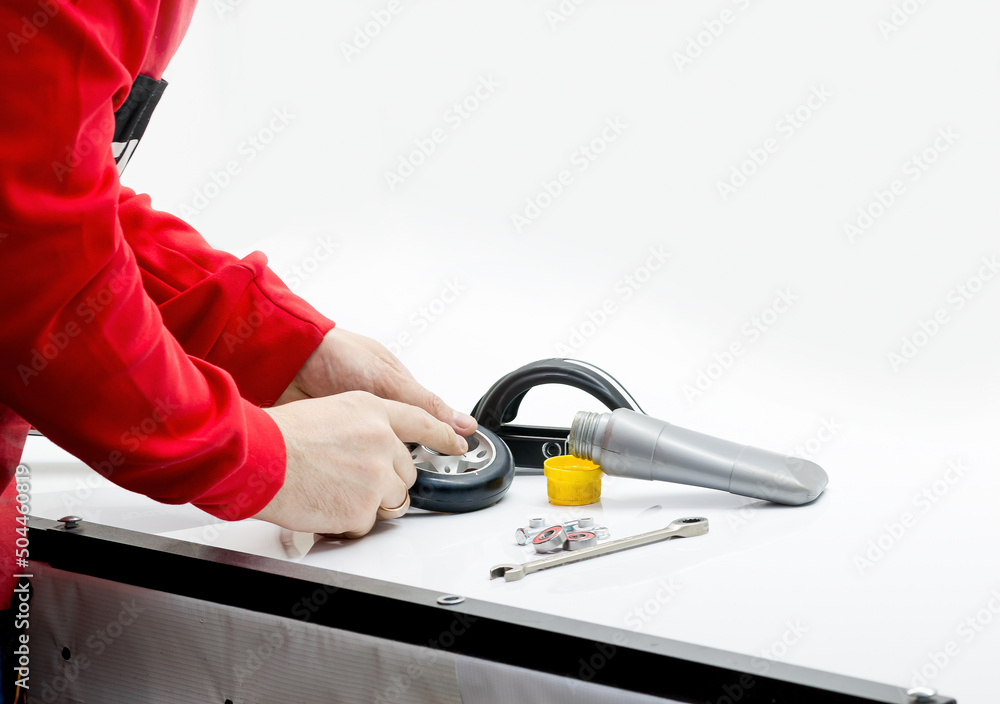 White table of roller ski service. Roller ski repair process with wheel ...