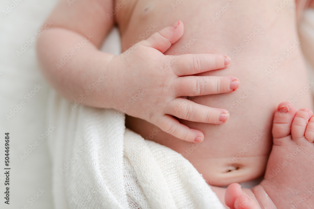 Baby fingers on his belly Stock Photo | Adobe Stock