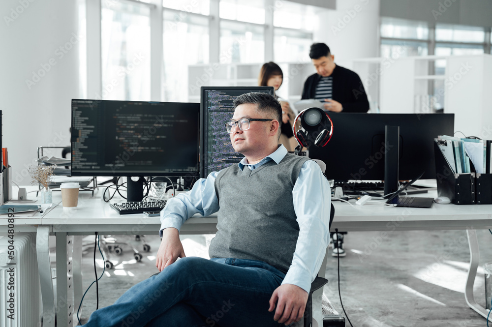Portrait of Chinese male engineer with computer in office Stock Photo ...