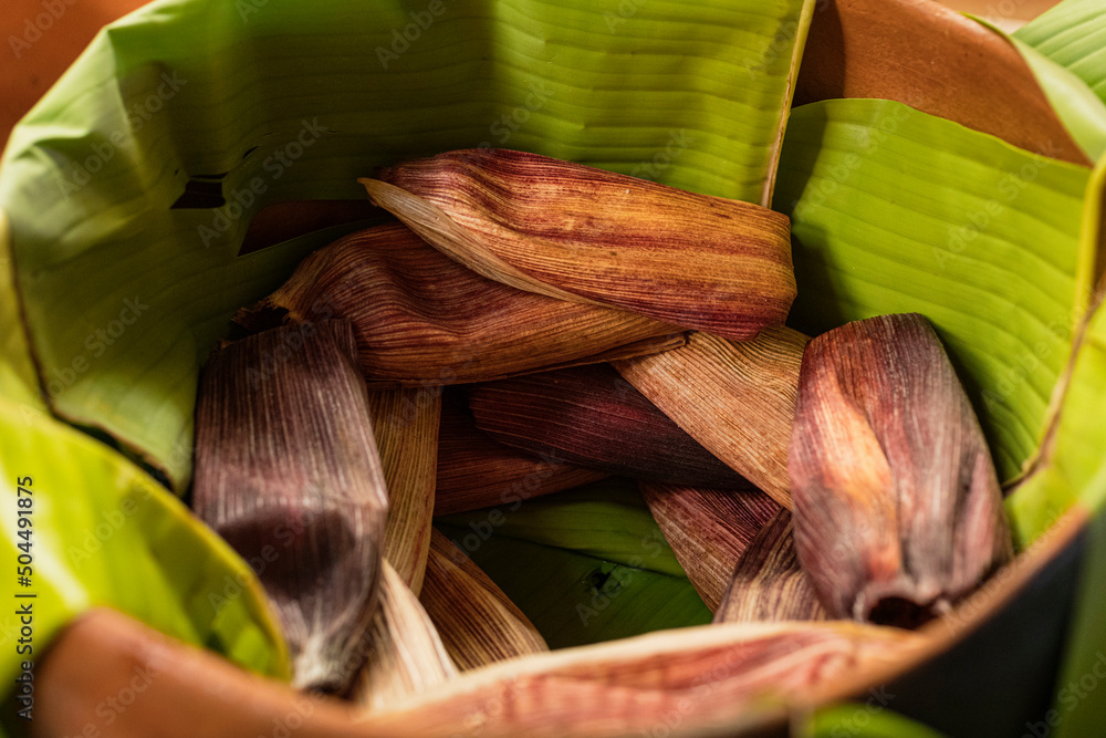 tamales stacked inside a clay container Stock Photo | Adobe Stock