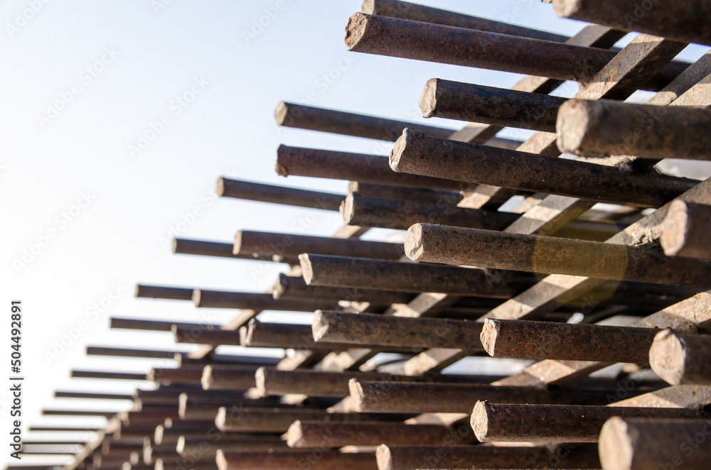 Steel reinforcement for concrete reinforcement stacked in rows. Close ...