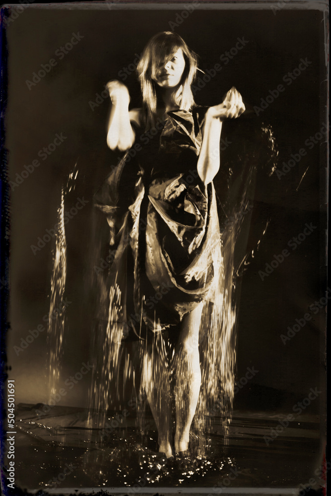 Abstract woman in sepia golden sparkling dress Stock Photo | Adobe Stock