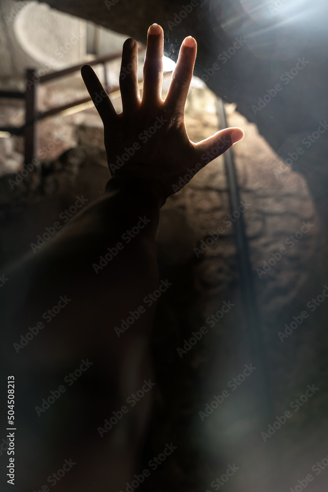 Light from lamps falls through male hand Stock Photo | Adobe Stock