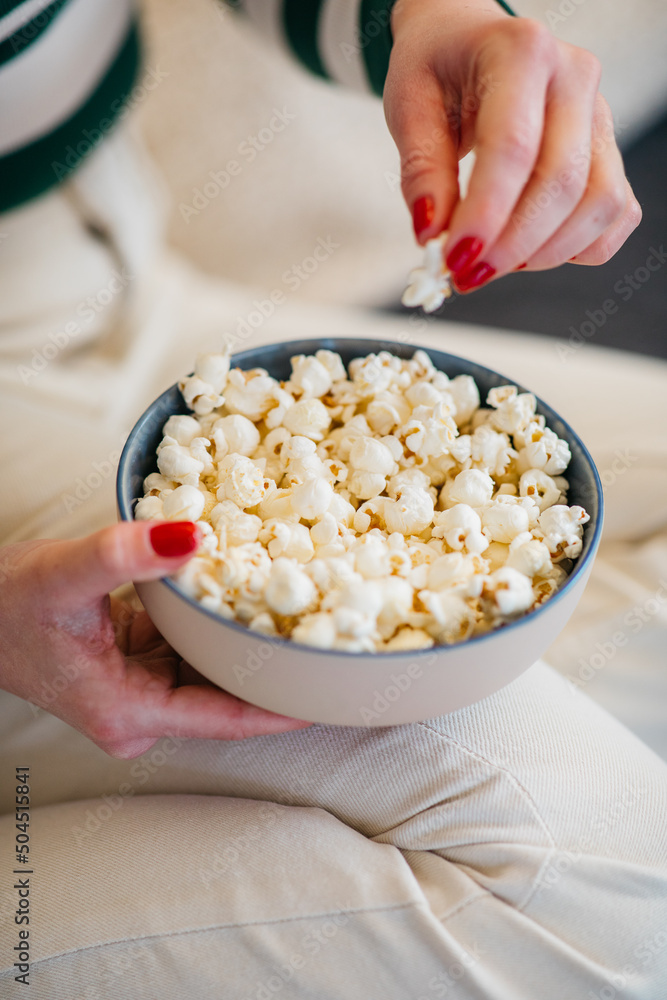Woman Eating Popcorn Stock Photo | Adobe Stock