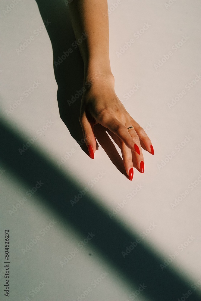 hand in light shape Stock Photo | Adobe Stock