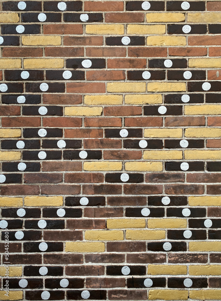 brick wall with dots Stock Photo | Adobe Stock