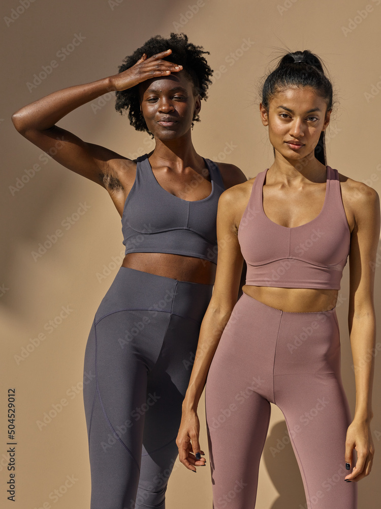 Fit models portrait over studio background Stock Photo | Adobe Stock