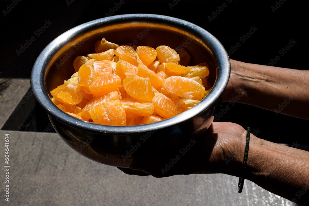 Slices of orange peeled completely and chopped and cut to make orange ...
