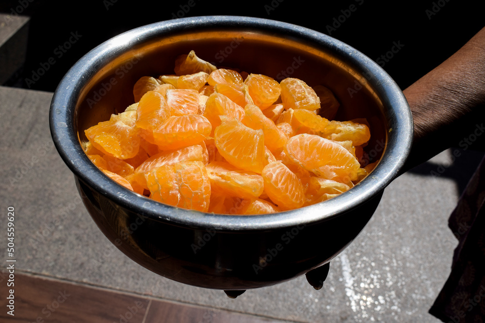 Slices of orange peeled completely and chopped and cut to make orange ...