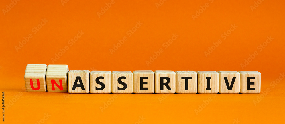 Assertive or unassertive symbol. Turned wooden cubes and changed ...