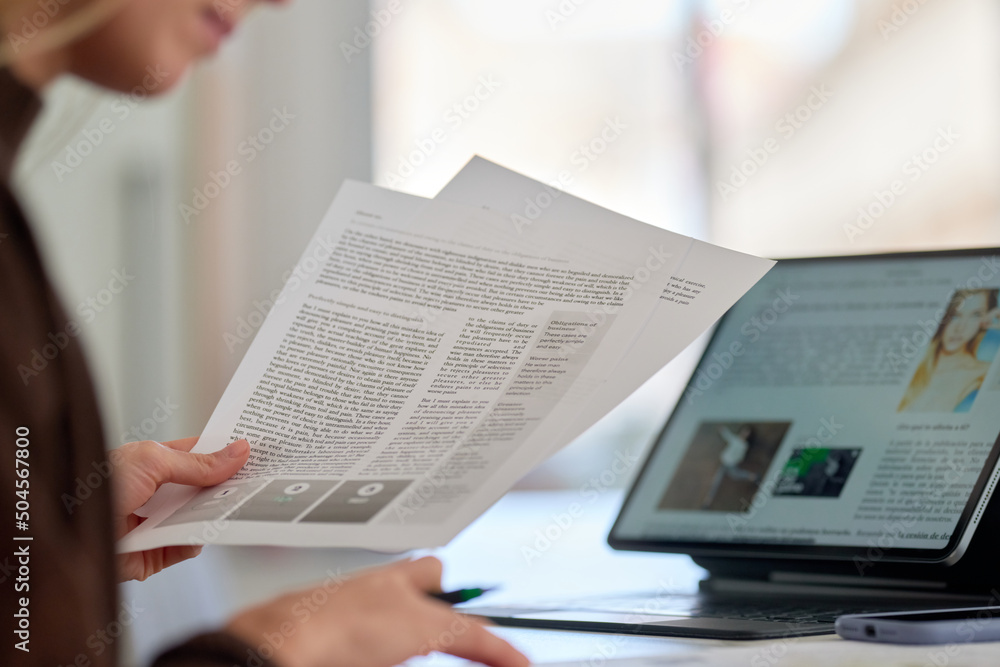 Female freelancer working with article Stock Photo | Adobe Stock