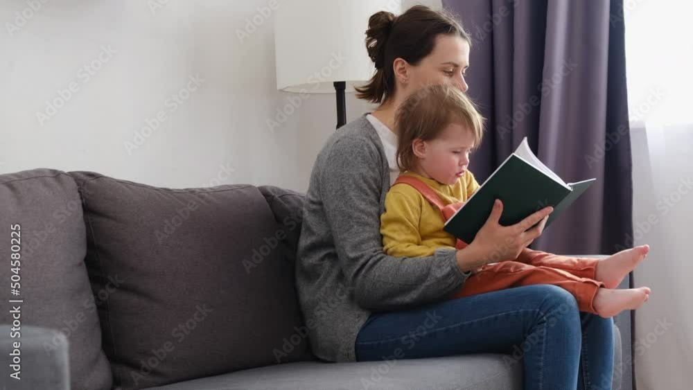 Caring young mother babysitter hug happy cute little kid daughter hold ...