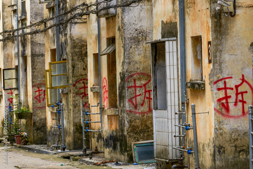 Demolition words are written on the abandoned old residential buildings ...