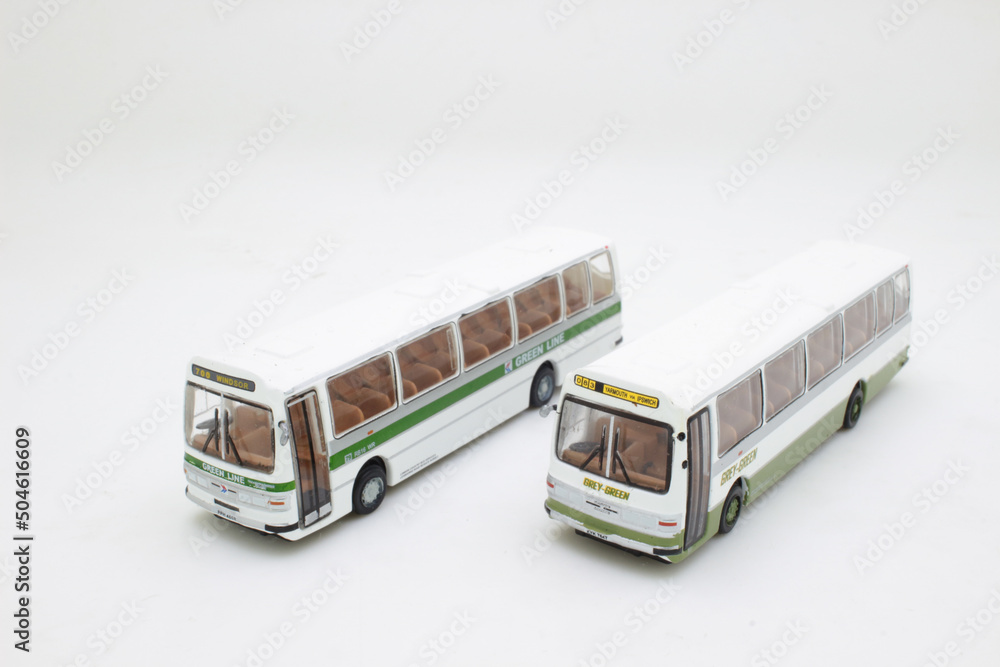 a Scale model of a white bus. Toy green bus Stock Photo | Adobe Stock
