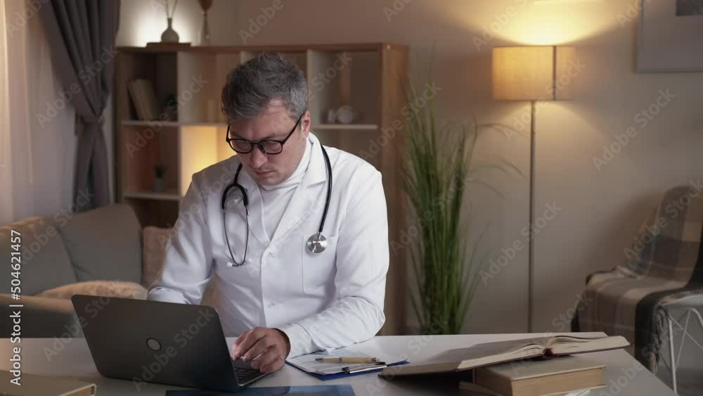 Medical report. Male doctor. Digital technology. Concentrated busy man ...