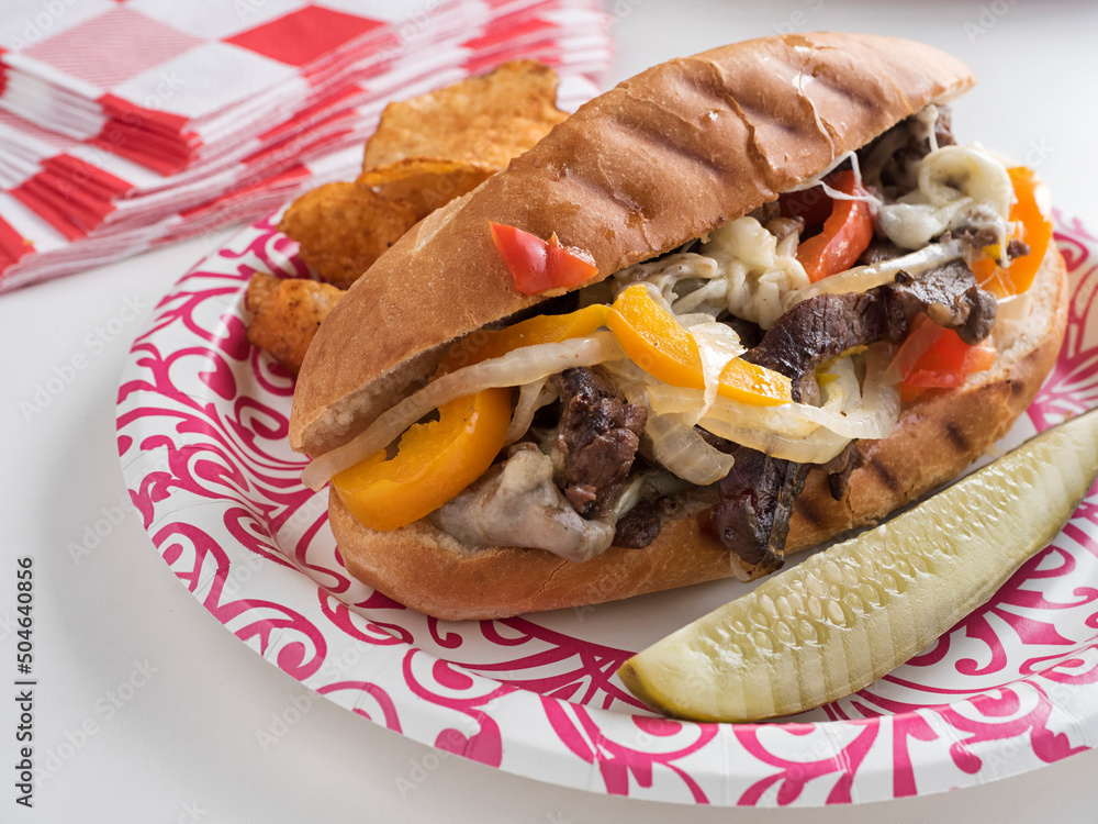 Poster A sirloin and cheese hoagie with sauteed peppers and onions ...