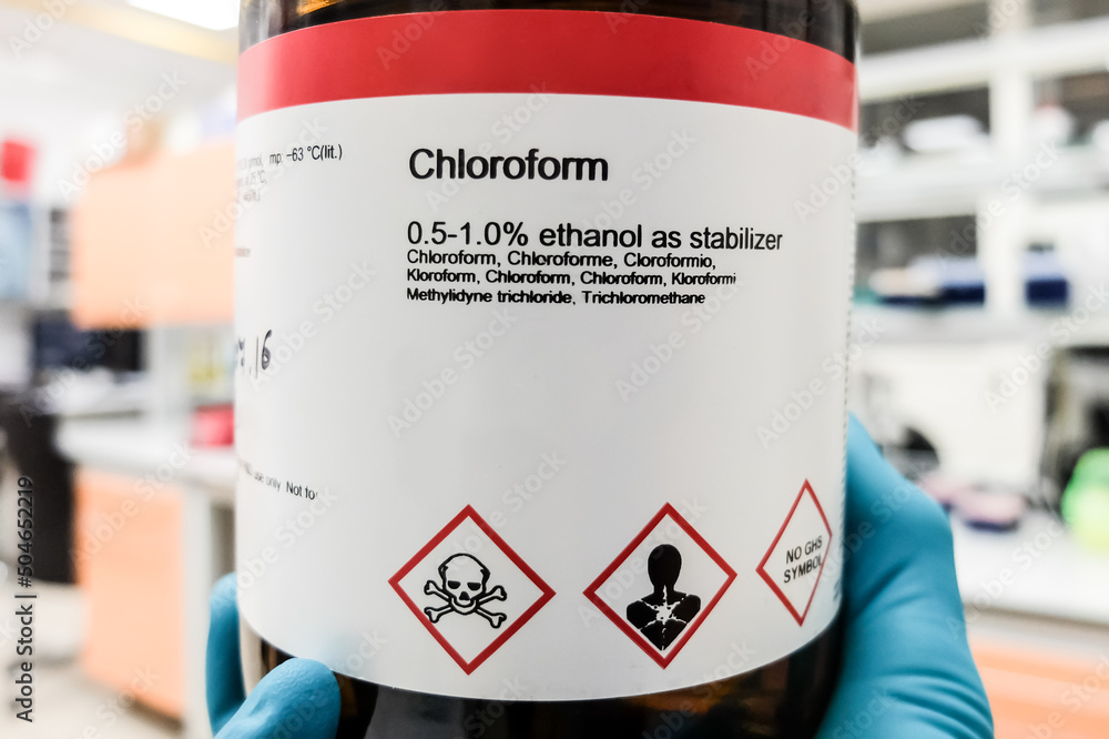A bottle of chloroform. Appropriate safety symbols are visible on the ...