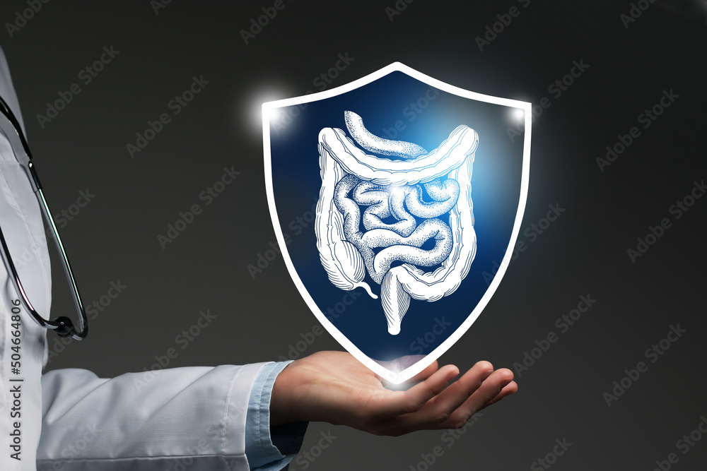 Unrecognizable female doctor holding shield and graphic virtual ...