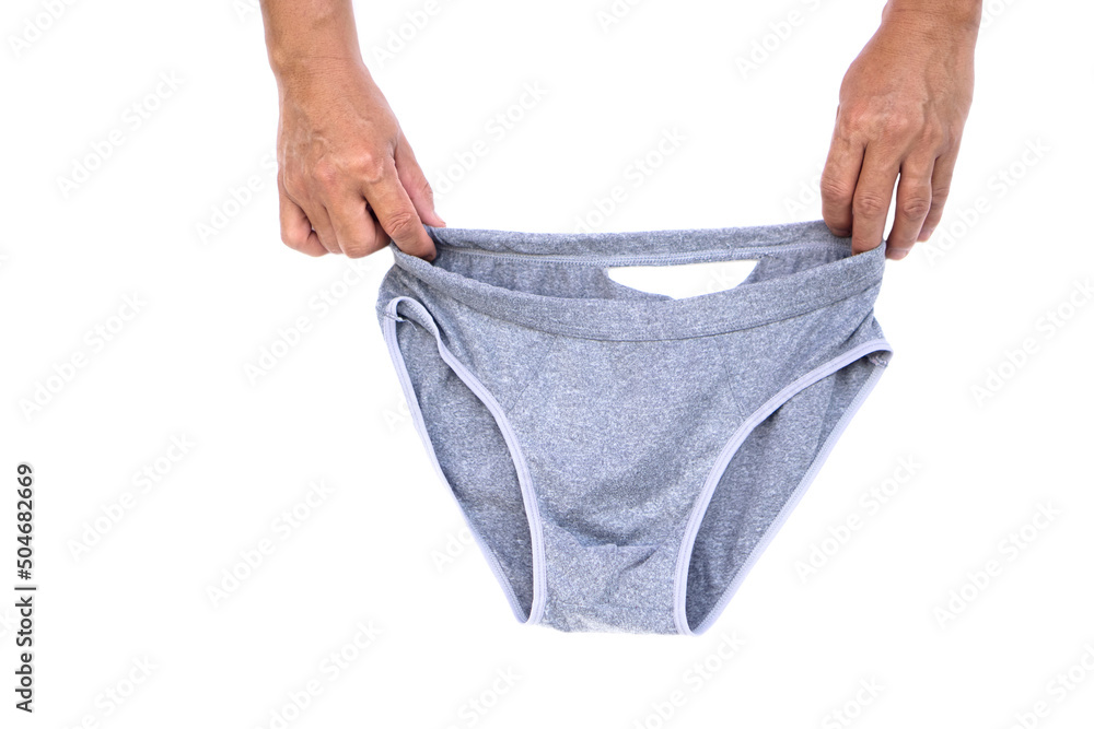 Man's hand hold old and torn underwear pants from long time wearing ...