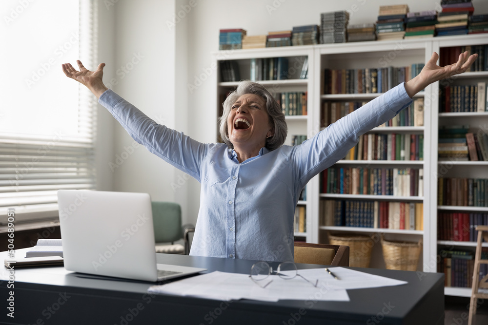 Happy euphoric mature business professional woman excited with job ...
